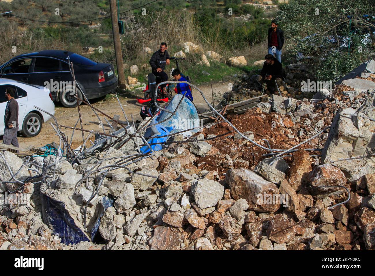 Salfit, Palestine. 28th Nov, 2022. Palestinians inspect a destroyed ...