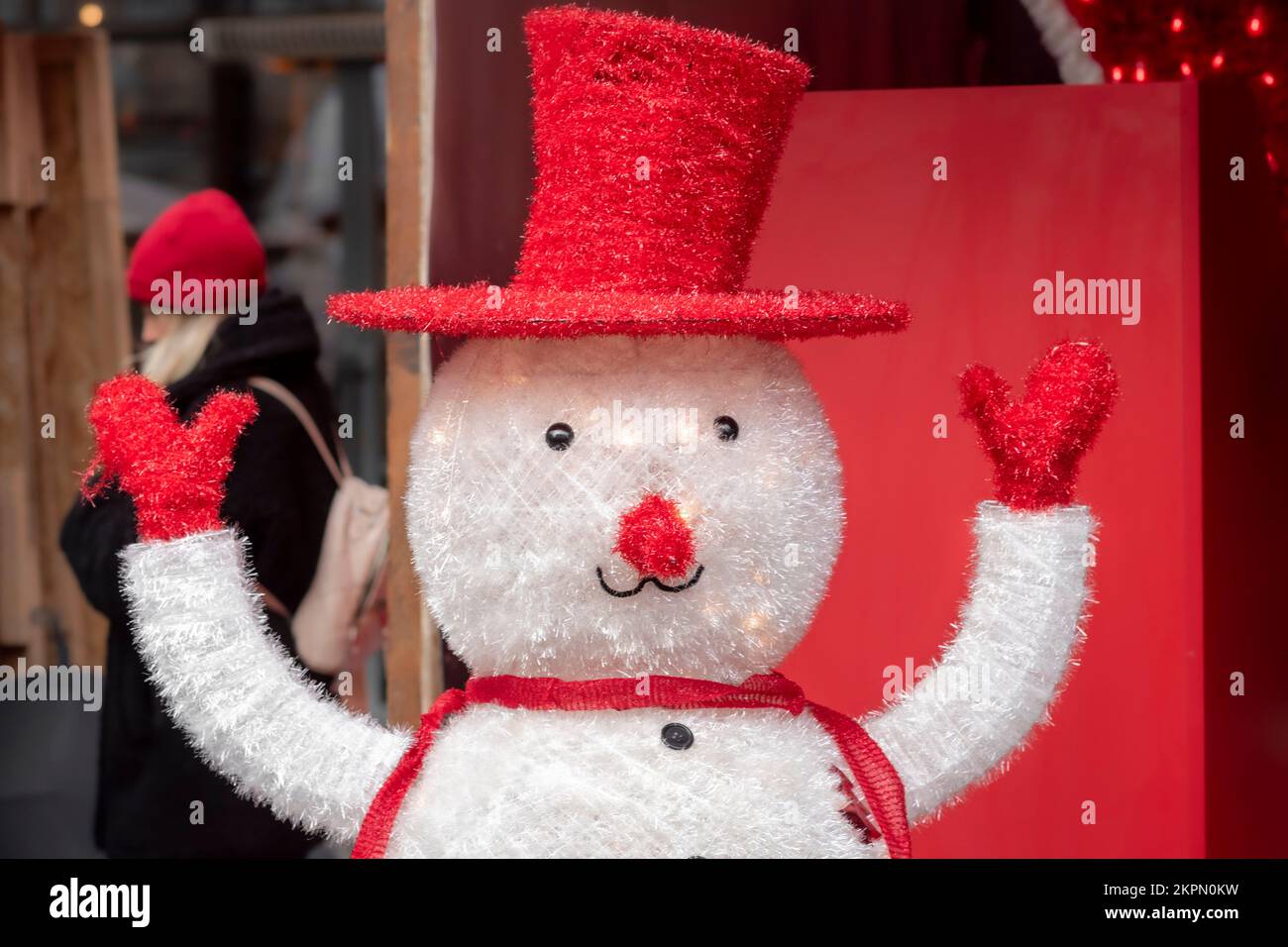 Huge decor snowman with red hat welcoming guests at a Christmas market ...