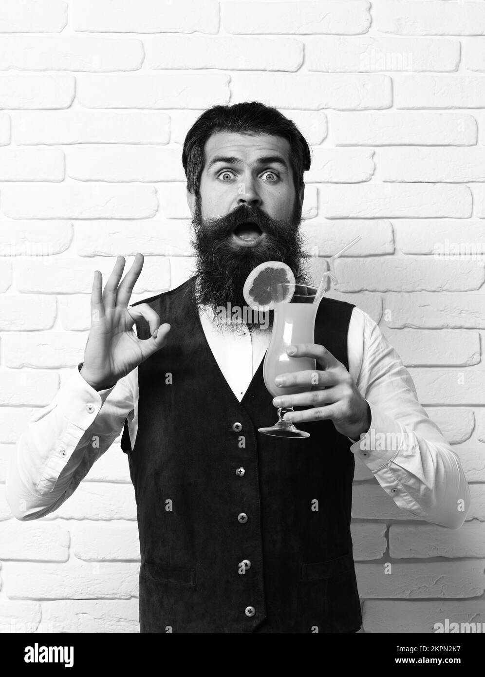 Surprised bearded man hold Black and White Stock Photos & Images - Alamy