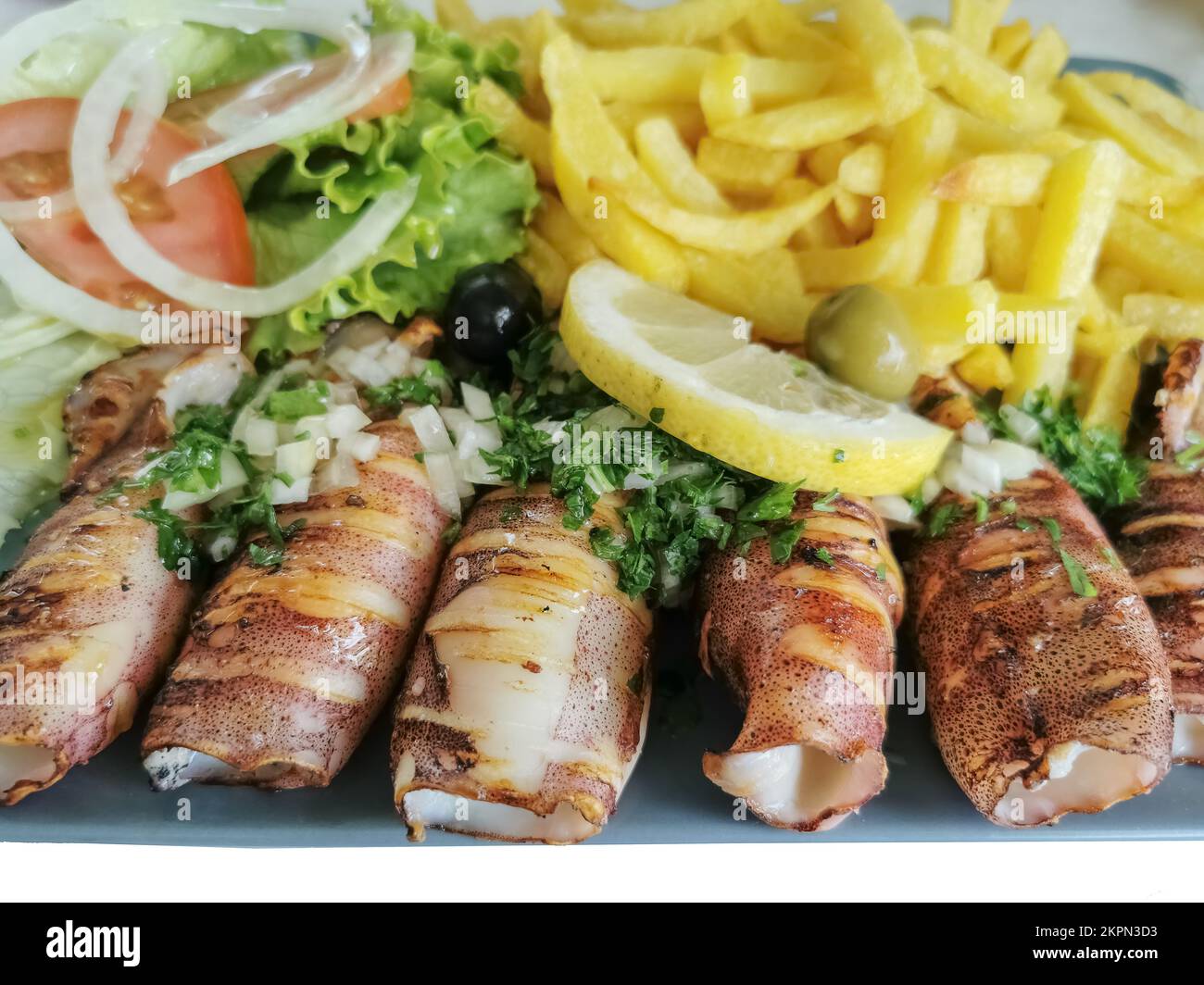 View of plated food, Healthy grilled cuttlefish dish stuffed with ...