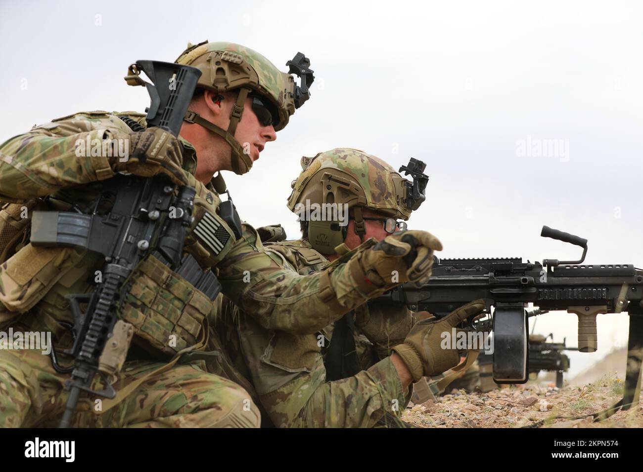 A U.S. Army Staff Sgt., left, identifies enemy targets for a U.S. Army ...