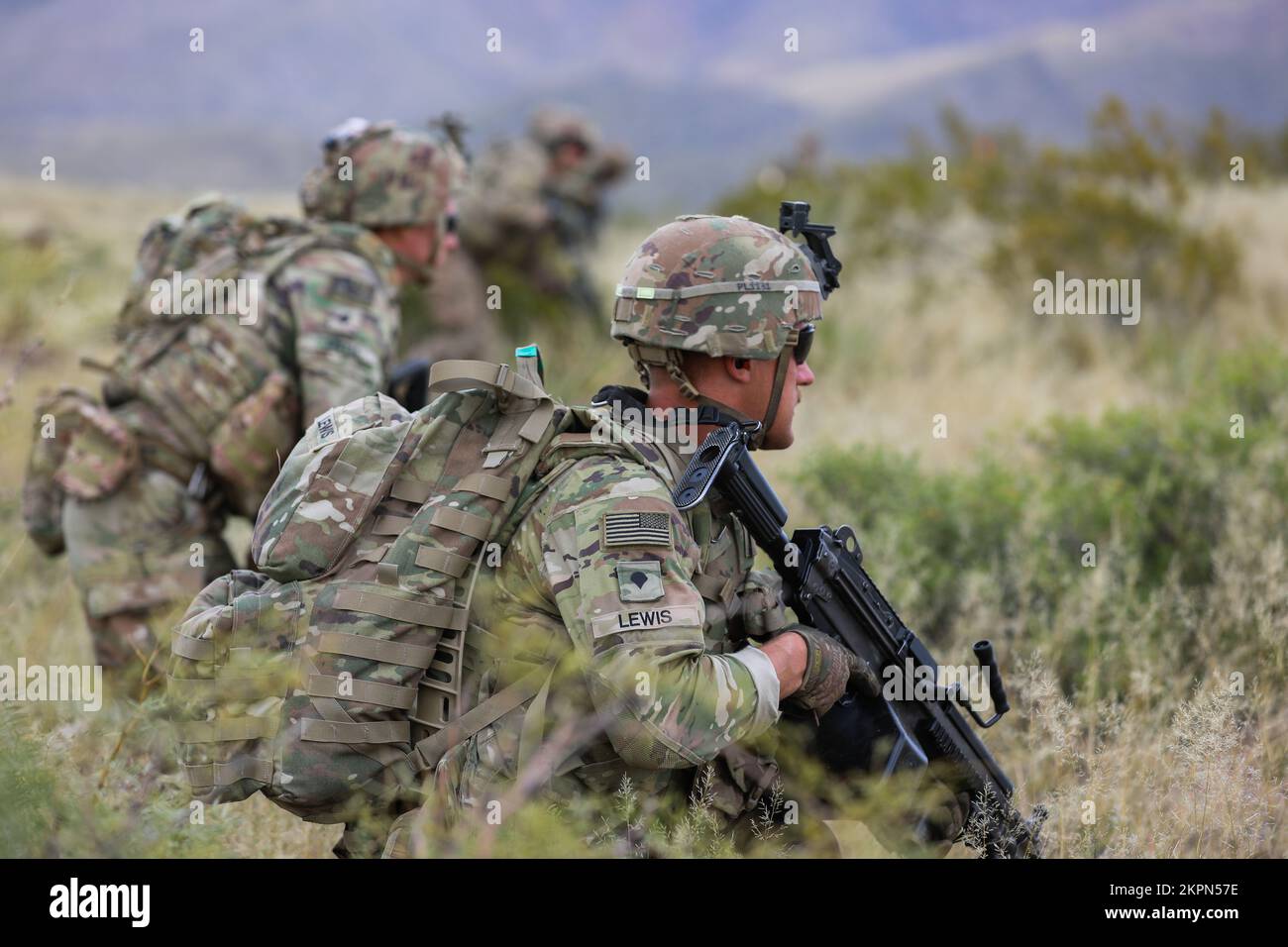 U.S. Army Spc. Paul Lewis, an automatic rifleman assigned to 1st ...