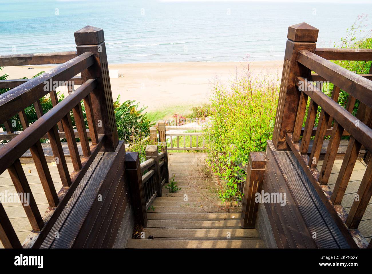 wooden stairs to the beach on the sea Wooden steps leading to the exit ...