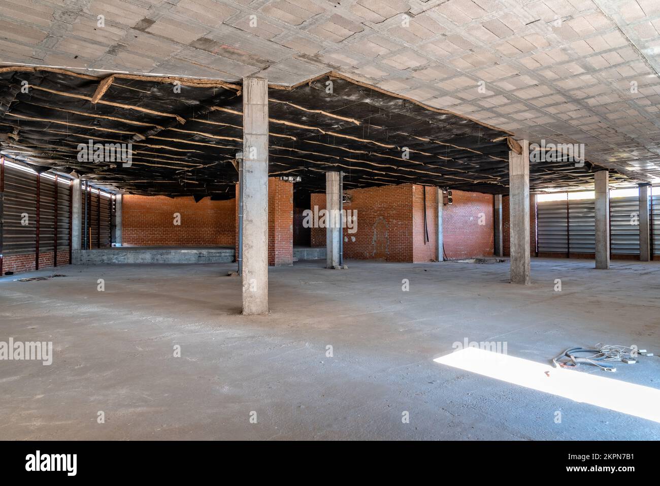 Interior view of unfurbished commercial space ready for rental in a new ...
