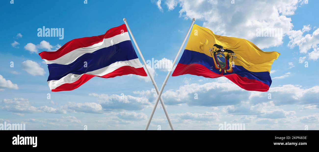 two crossed flags Ecuador and Thailand waving in wind at cloudy sky ...