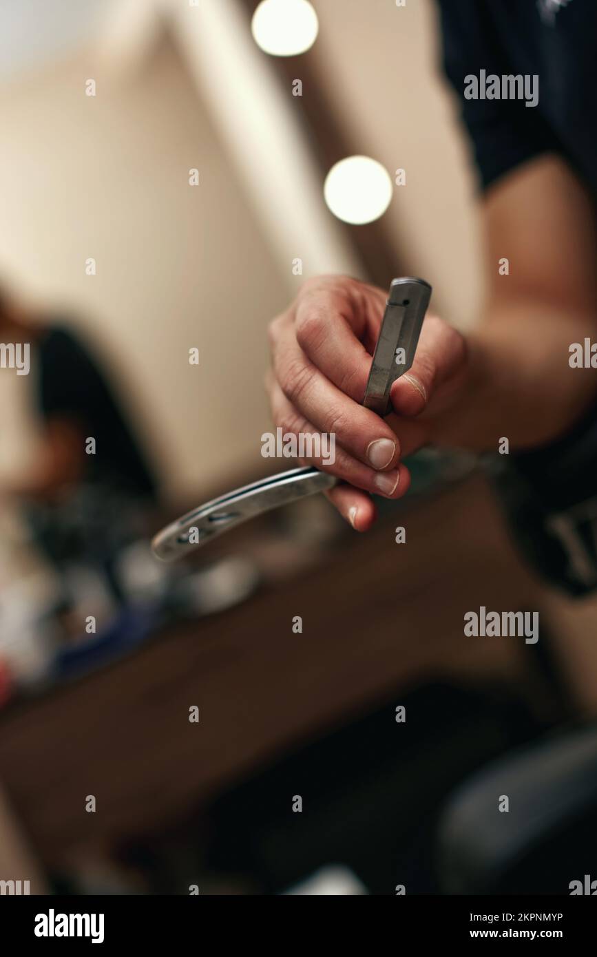 barber hand testing the sharpness of blade Stock Photo - Alamy