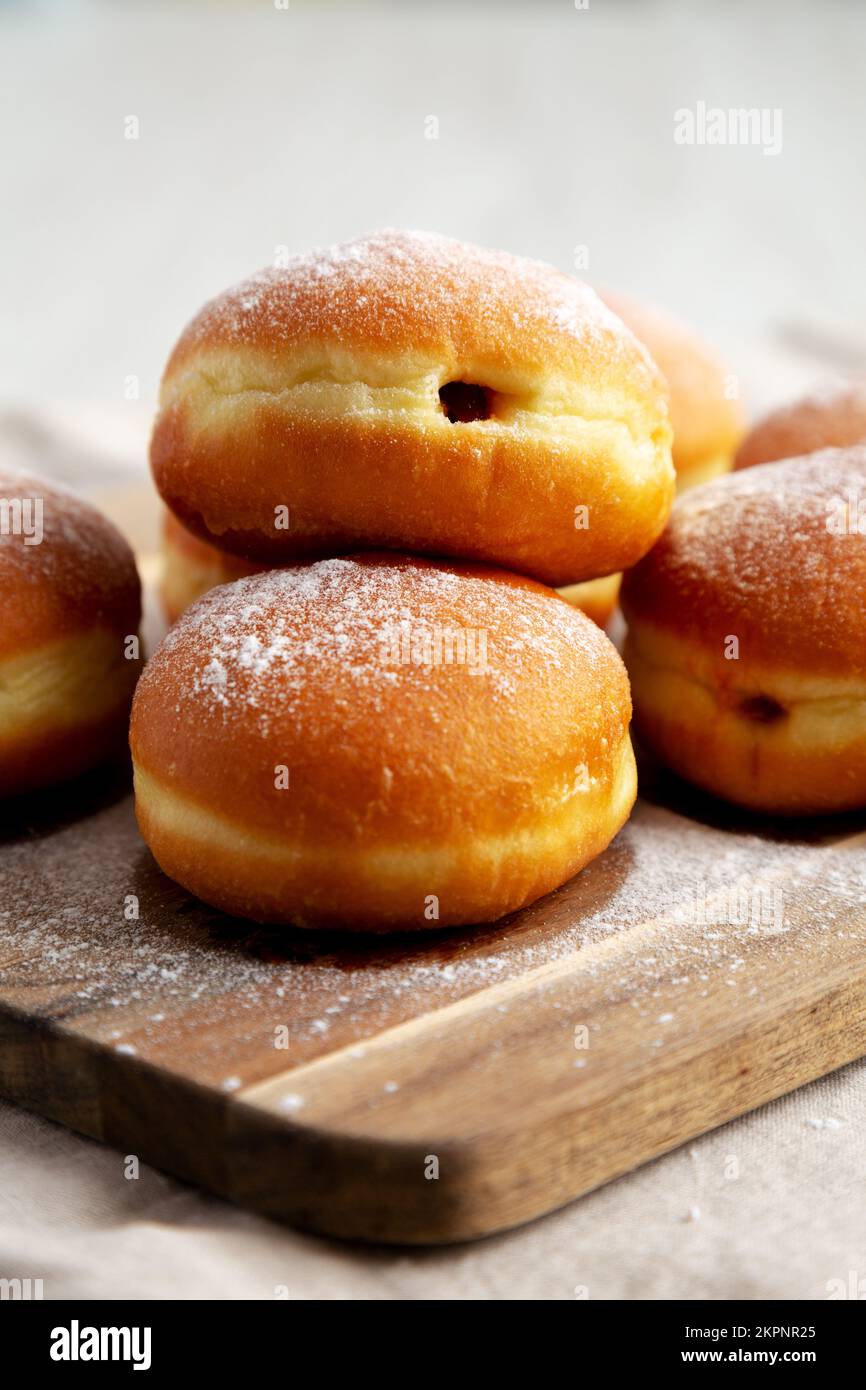 Homemade Apricot Polish Paczki Donut with Powdered Sugar on a Wooden ...