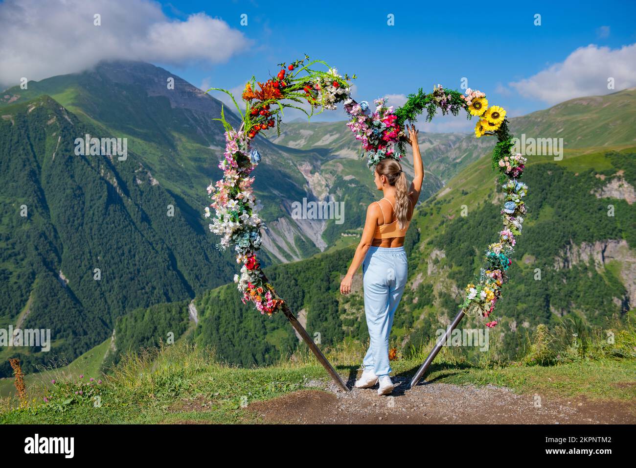 one girl at the arch in the form of a heart at the Arch of Friendship ...