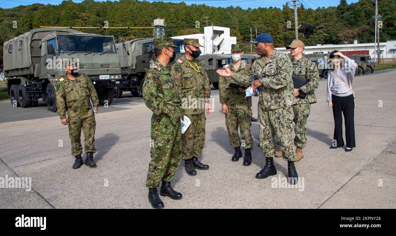 Capt. David Adams, Commander, Fleet Activities Sasebo, speaks with ...