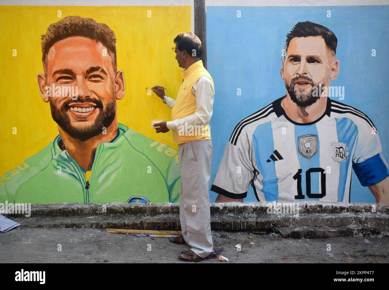 A painter applies finishing touches to an image of Argentina's soccer ...