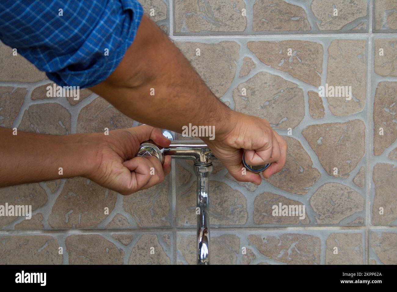 Image Of A Mans Hands Turning Off The Water Tap Saving And
