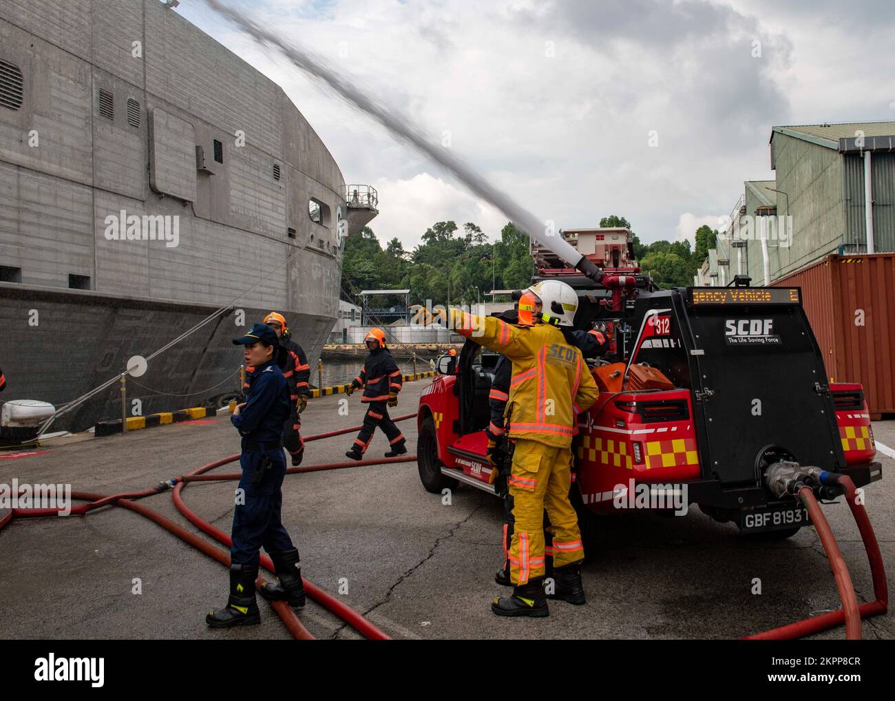221102-N-HG389-0062 SINGAPORE (Nov. 2, 2022) – Members of the Singapore Civil Defence Force take ...