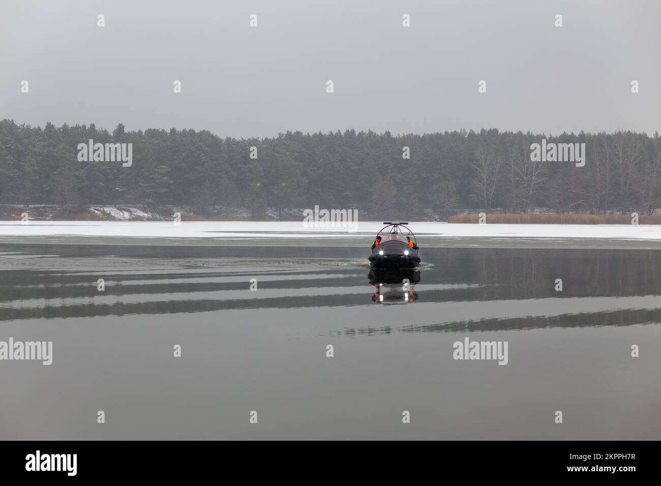 A rescue team is sailing on a hovercraft to rescue fishermen on the ...