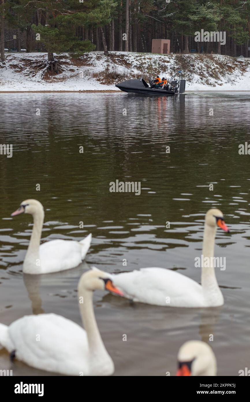 A rescue team is sailing on a hovercraft to rescue fishermen on the ...