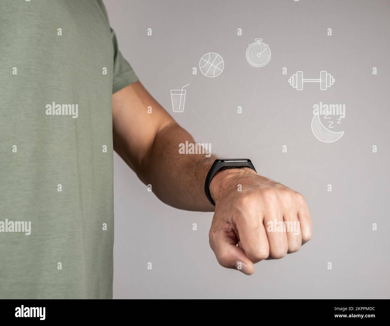 Fitbit, fitness tracker, pedometer, smartwatch on hand of male athlete ...