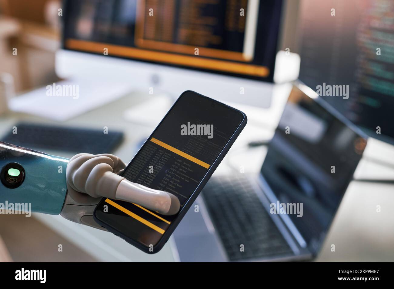 Closeup image of software developer holding smartphone with prosthetic arm Stock Photo - Alamy