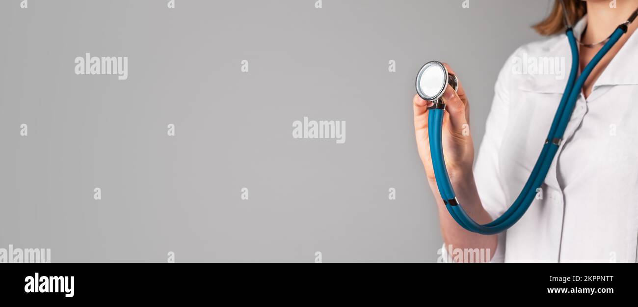 Doctor hand listening with stethoscope on ad background, banner ...