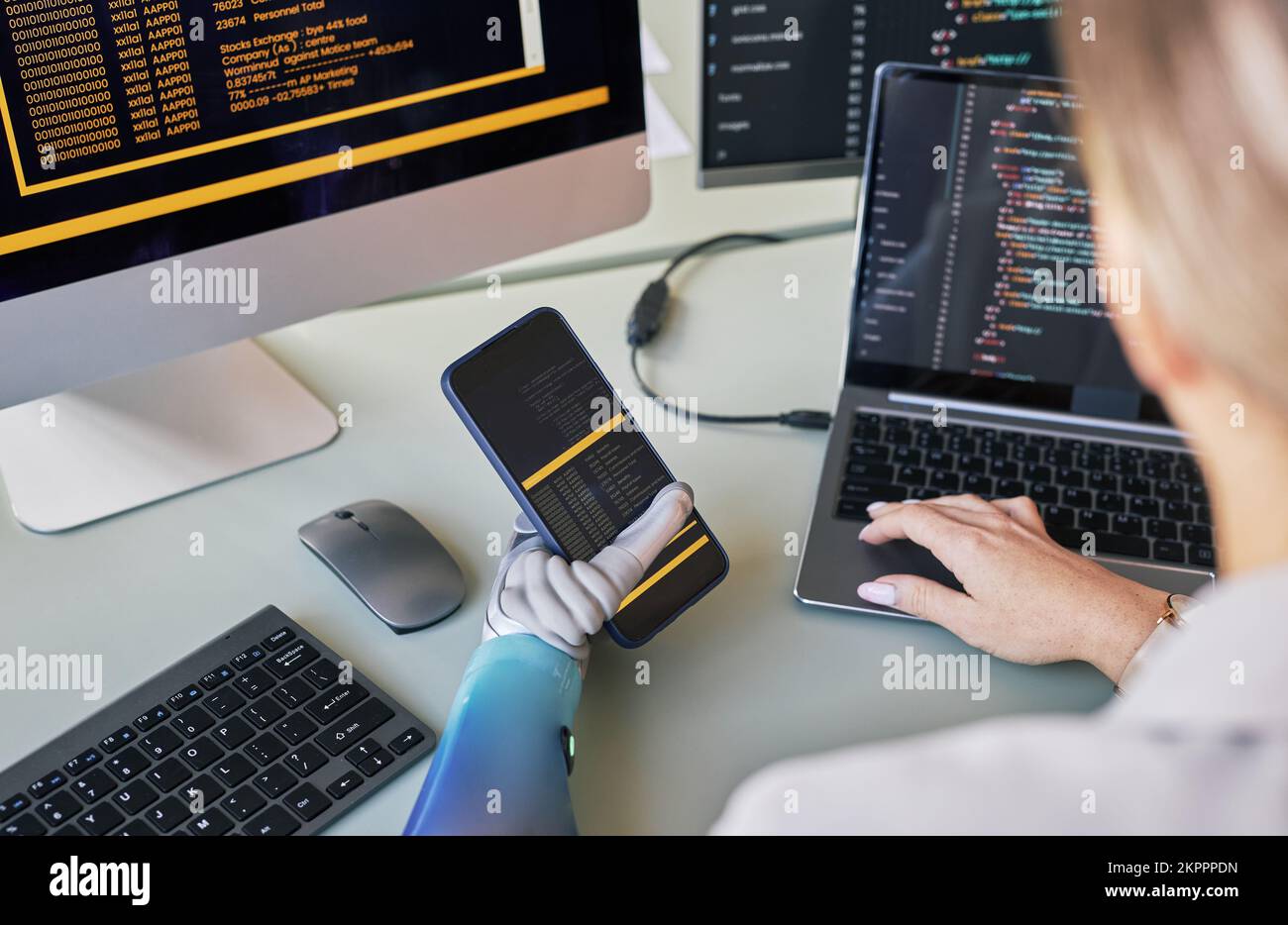 Female scientist working on mobile application for people with bionic ...