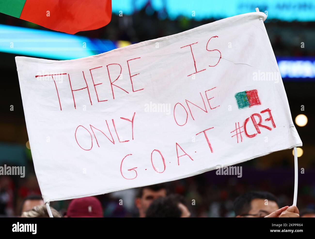 Doha, Qatar, 28th November 2022. Portugal fan holds up a banner during ...