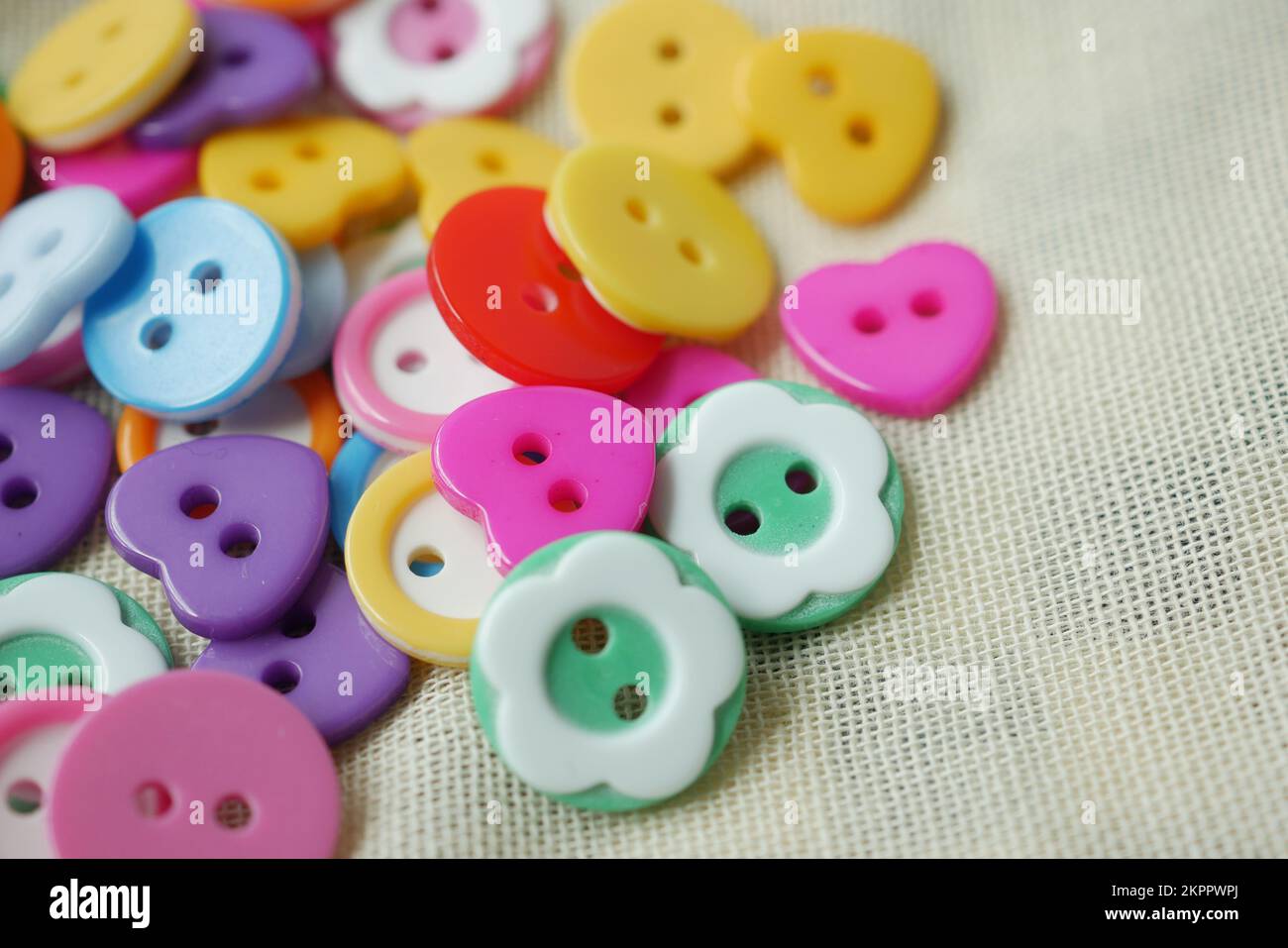 color Plastic buttons on white background Stock Photo - Alamy