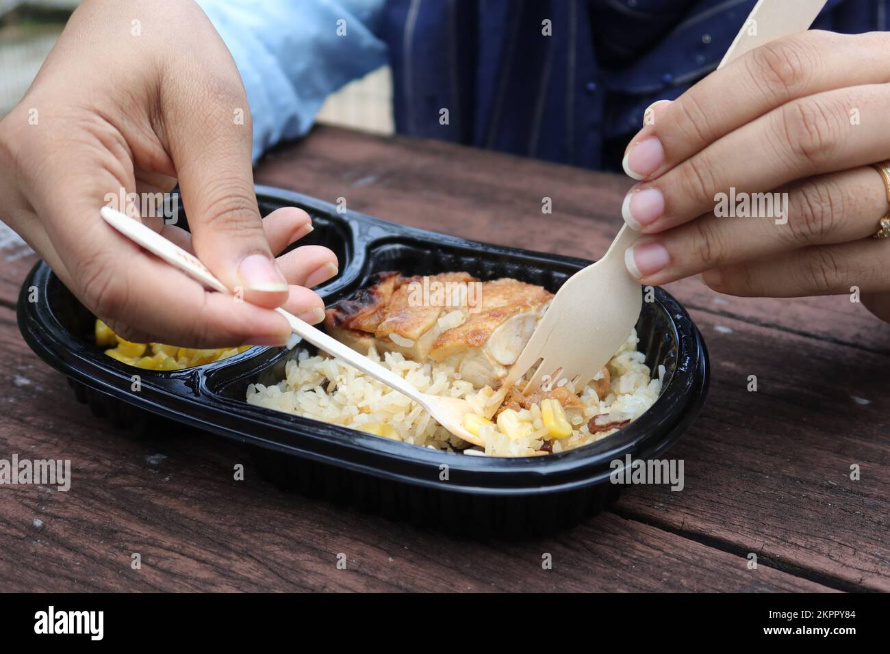 curry chicken and rice in a take away plastic packet on table Stock ...