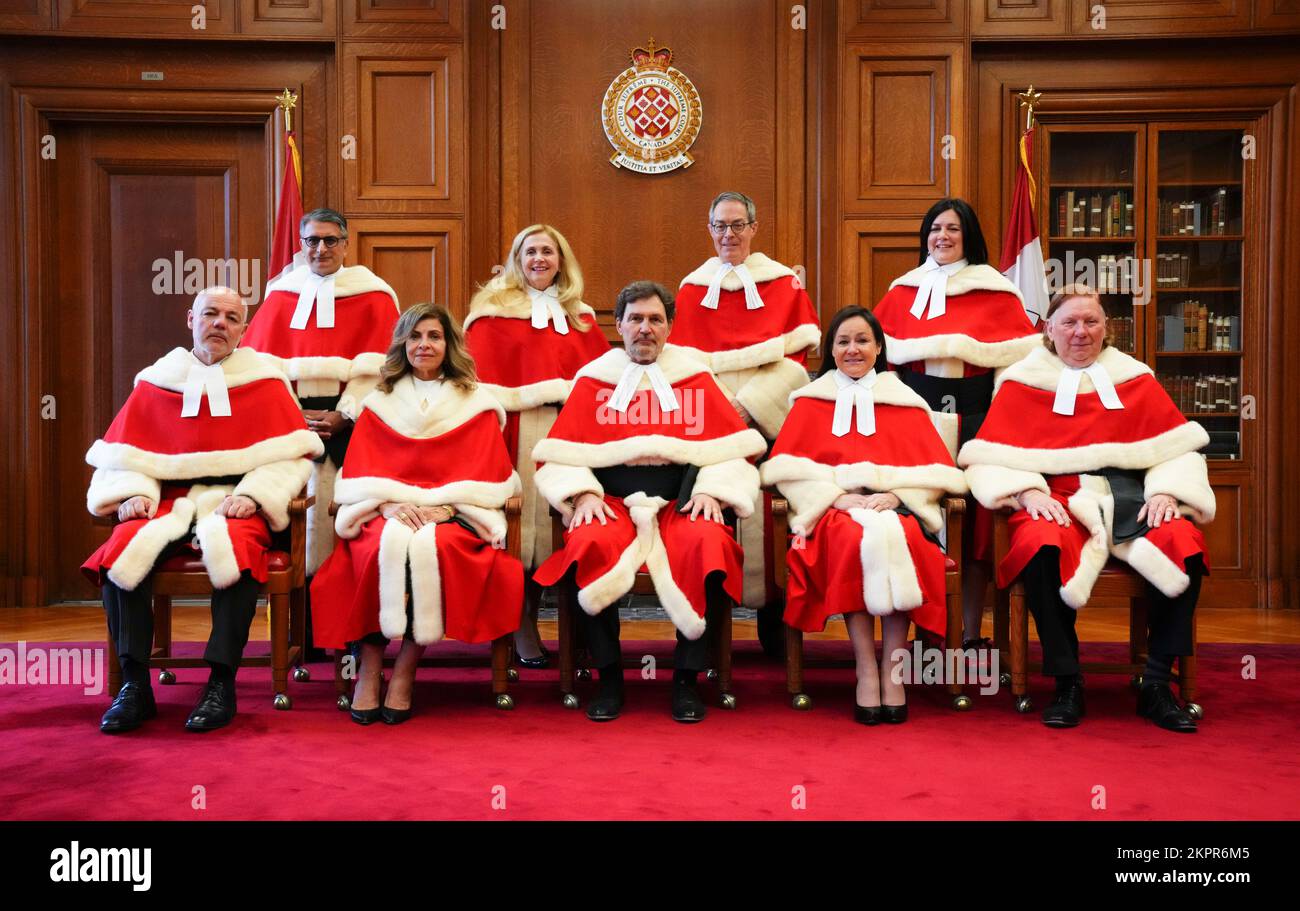 Justice Michelle O'Bonsawin, top right, takes part in a group photo ...