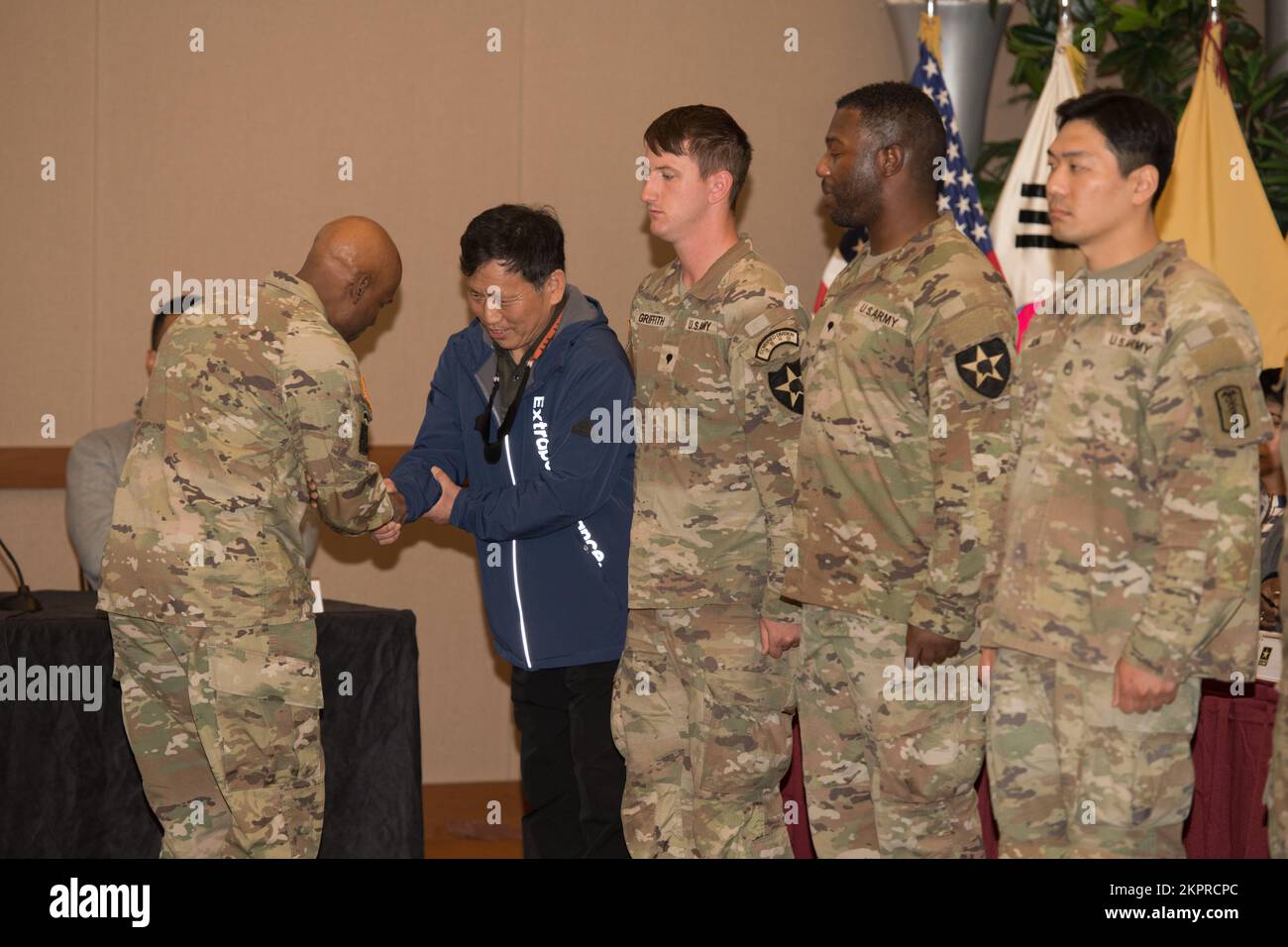 U.S. Army Soldiers and civilians receive a coin from Brig. Gen. Joseph ...