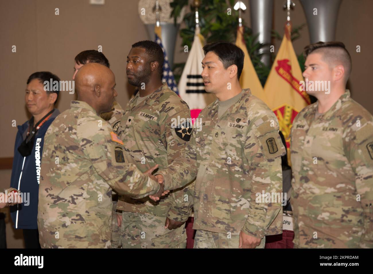 U.S. Army Soldiers and civilians receive a coin from Brig. Gen. Joseph ...