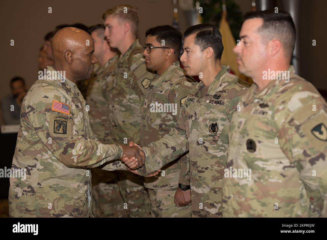 U.S. Army Soldiers and civilians receive a coin from Brig. Gen. Joseph ...