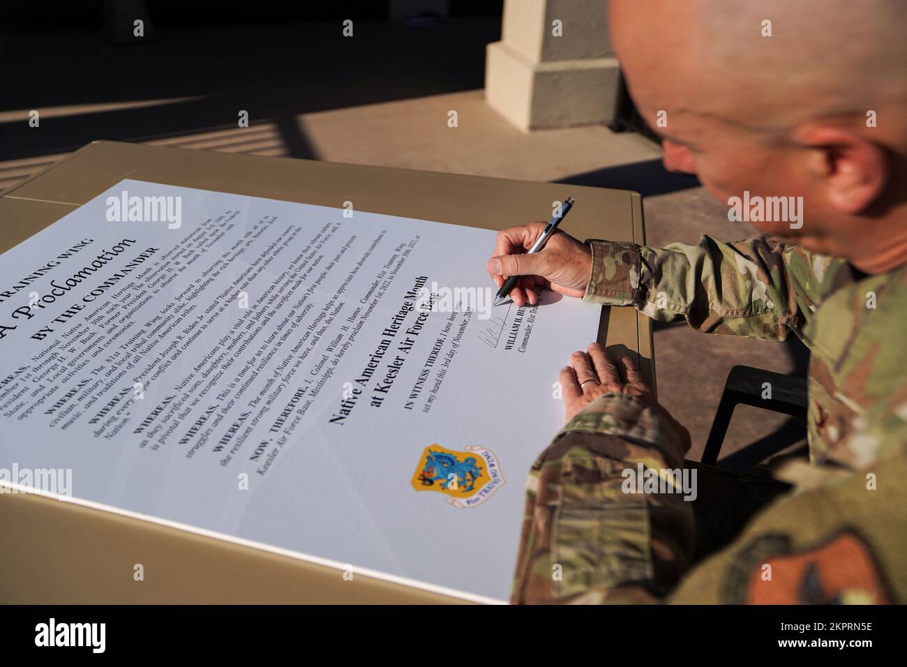 U.S. Air Force Col. William Hunter, 81st Training Wing commander, signs ...