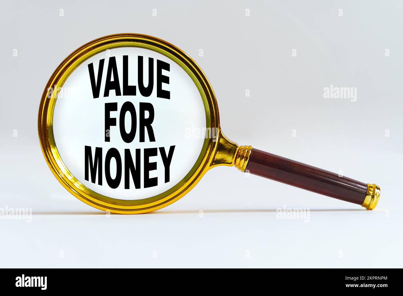Finance and economics concept. Magnifier on a white background, inside ...