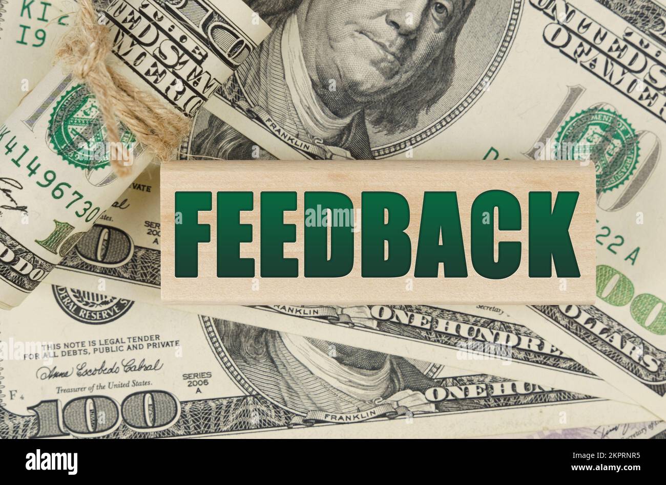 Business and finance concept. On the dollars is a wooden plate with the ...