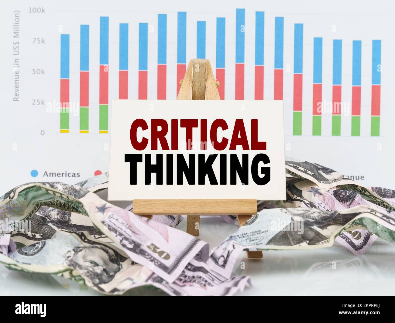 Business and finance concept. Among financial charts and money is a ...