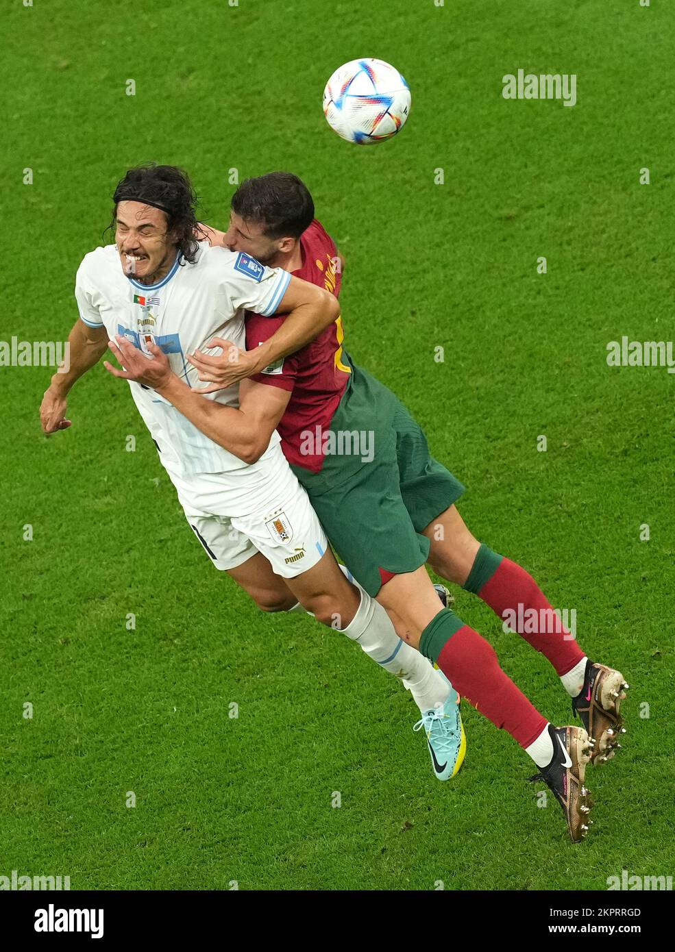 Uruguay's Edinson Cavani (left) and Portugal's Ruben Dias battle for ...