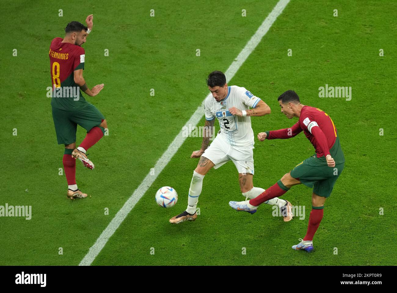 Portugal's Cristiano Ronaldo (right) attempts a shot on goal, hitting ...