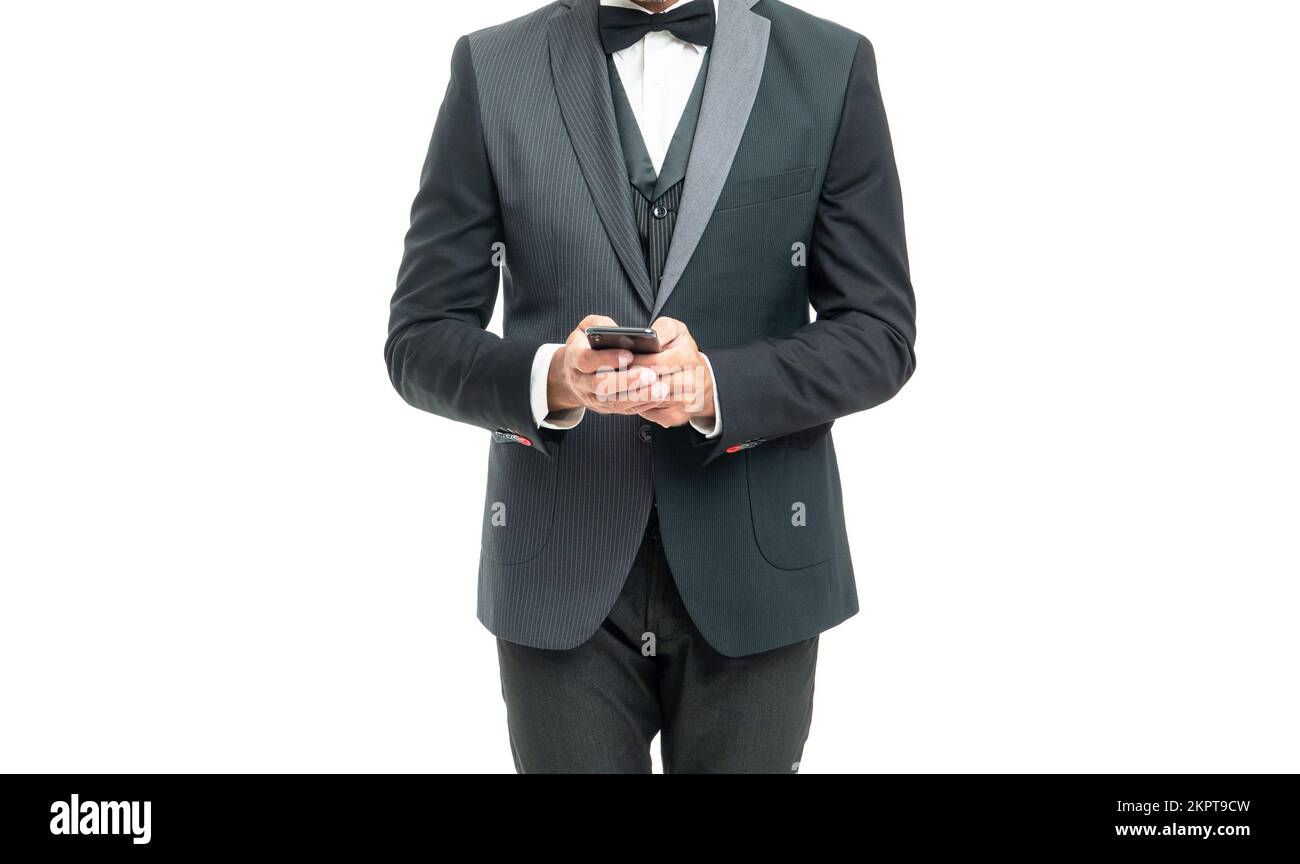 tuxedo man messaging on smartphone isolated on white background Stock ...