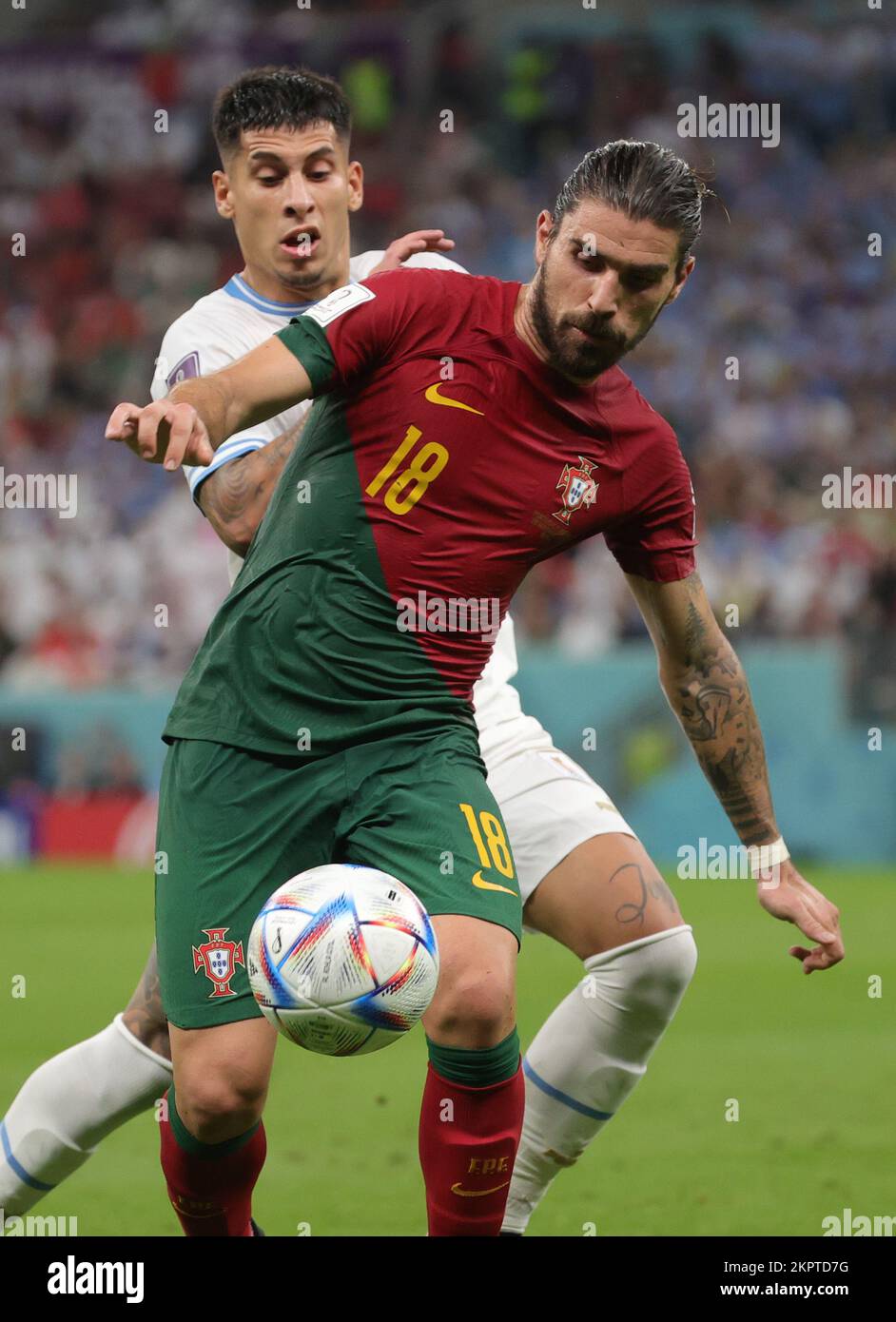 Lusail, Qatar. 28th Nov, 2022. Uruguay's Mathias Olivera and Portuguese ...