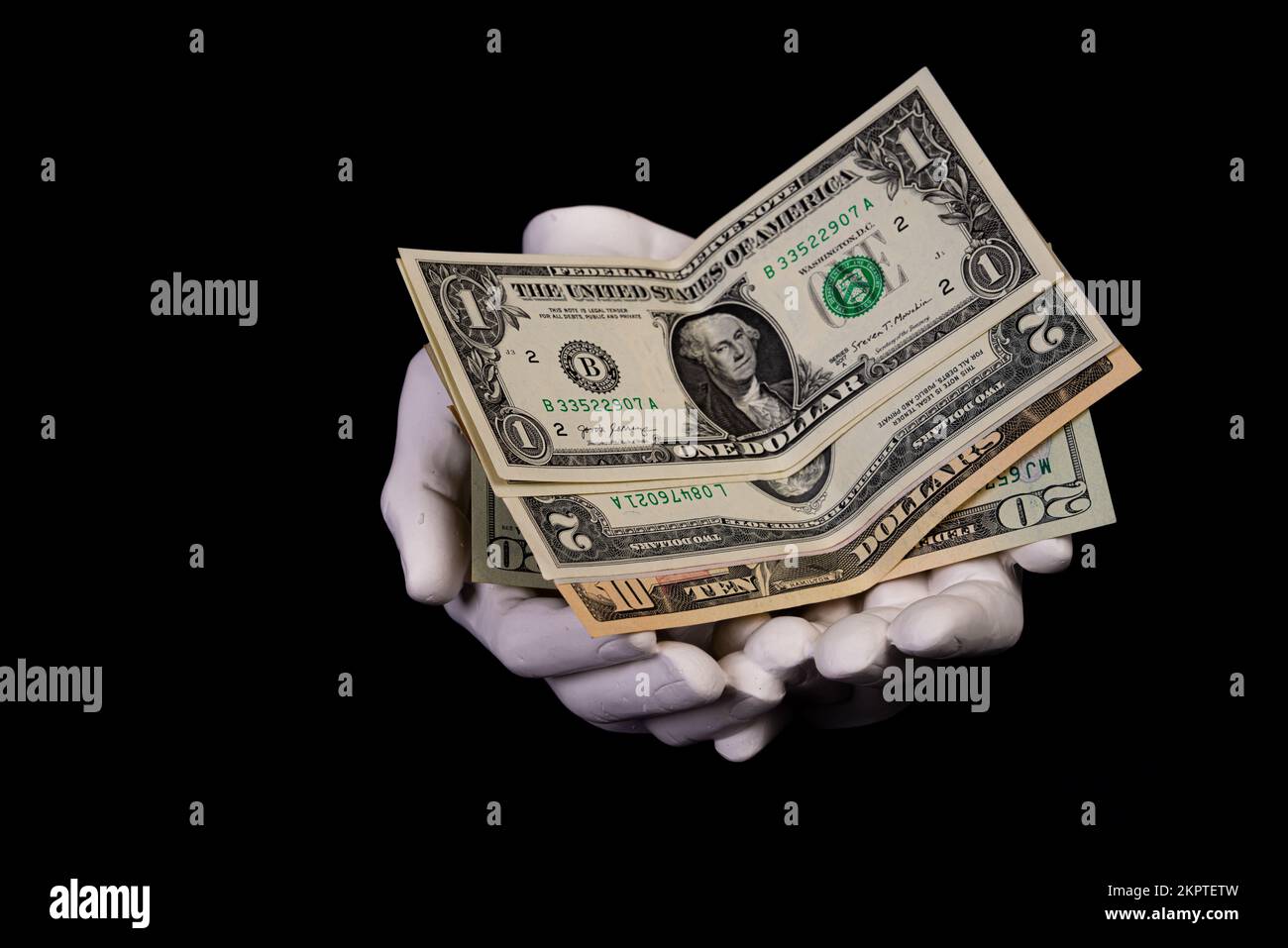 two hands with dollars. Closeup female hand giving money for something ...