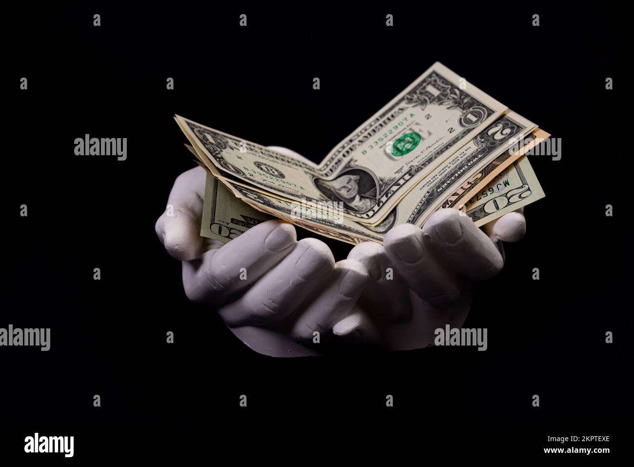 two hands with dollars. Closeup female hand giving money for something ...