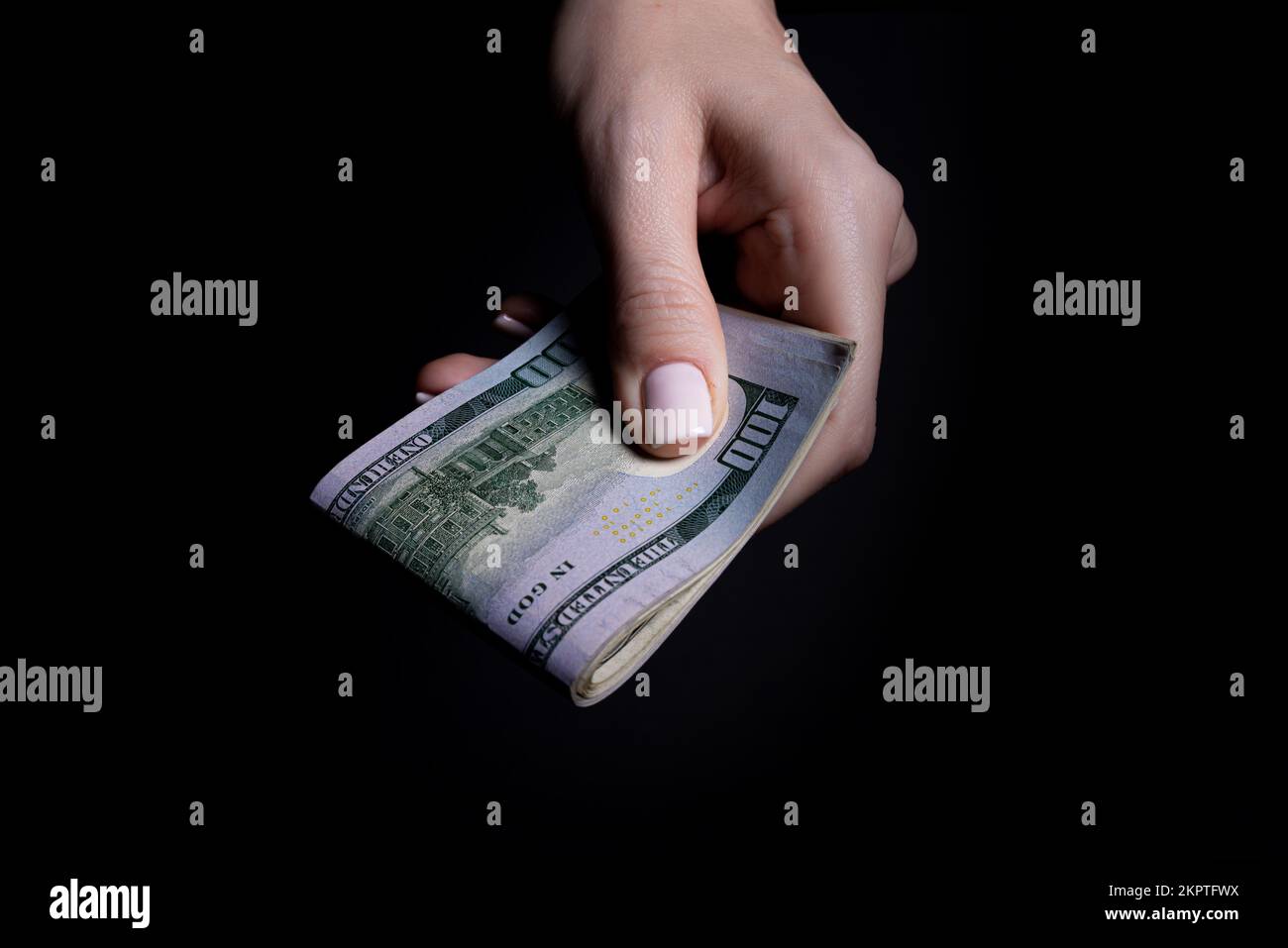 two hands with dollars. Closeup female hand giving money for something ...