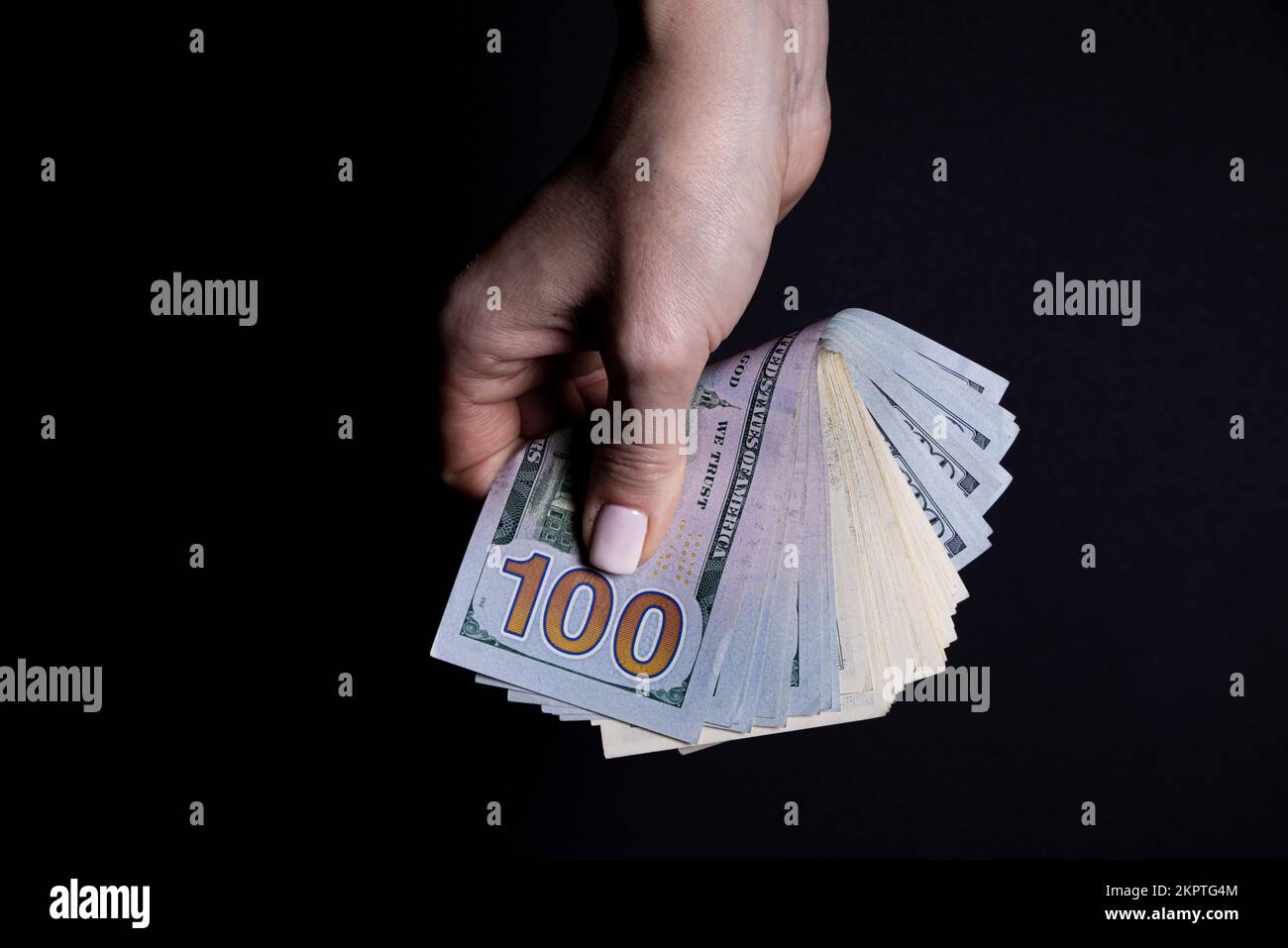 two hands with dollars. Closeup female hand giving money for something ...