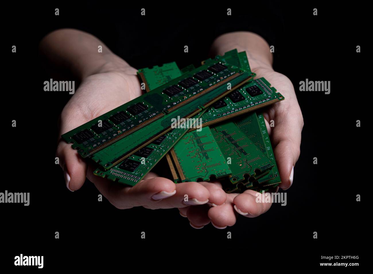 female hands hold memory computer card . american woman wearing ...