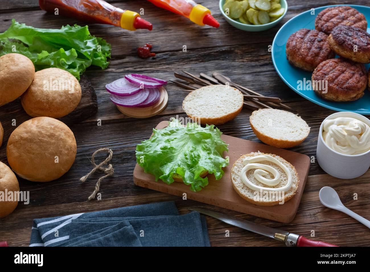 process of cooking delicious burgers with grilled meat cutlets, various ...