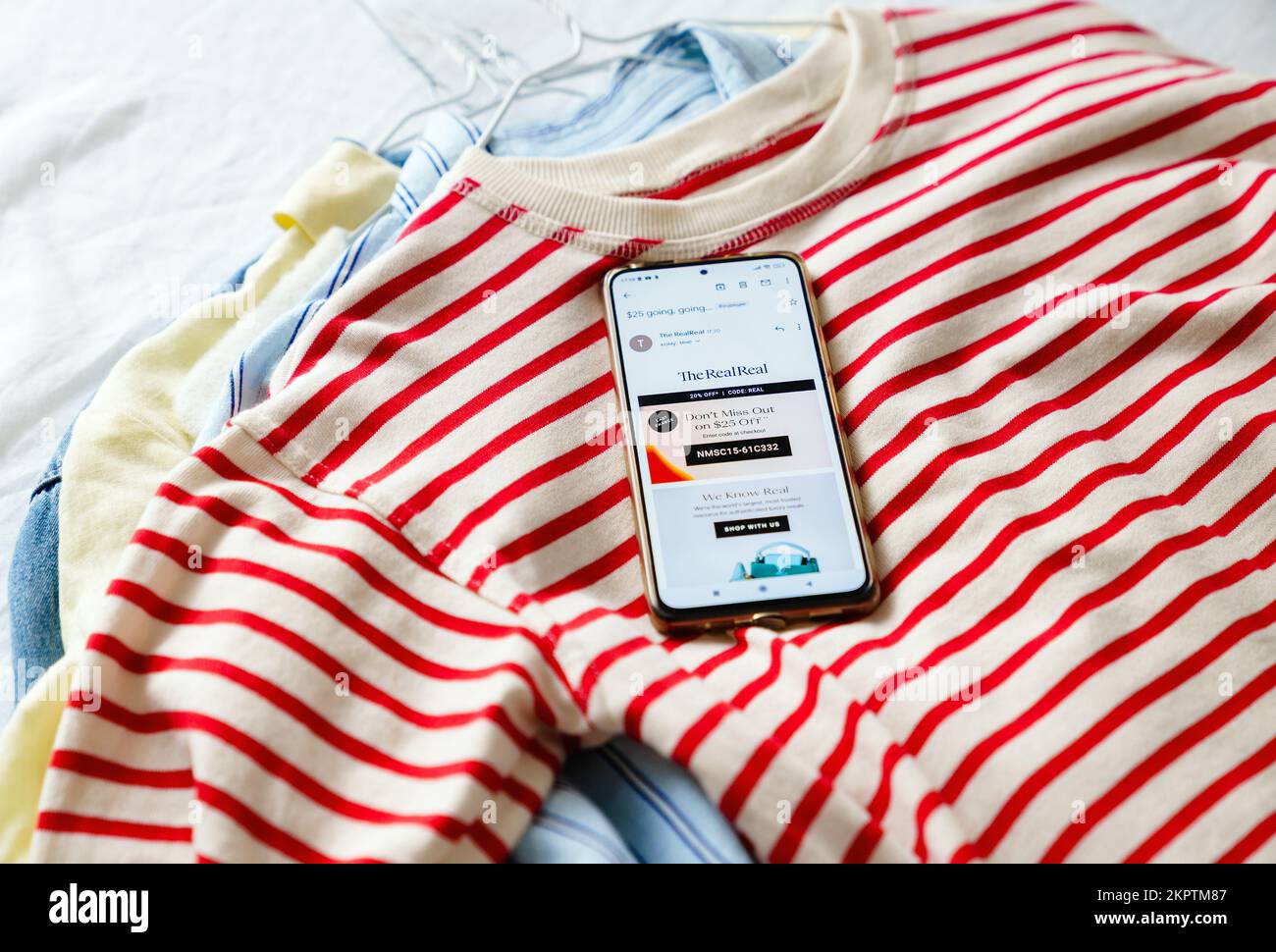 Smartphone with open site TheRealReal Stock Photo - Alamy