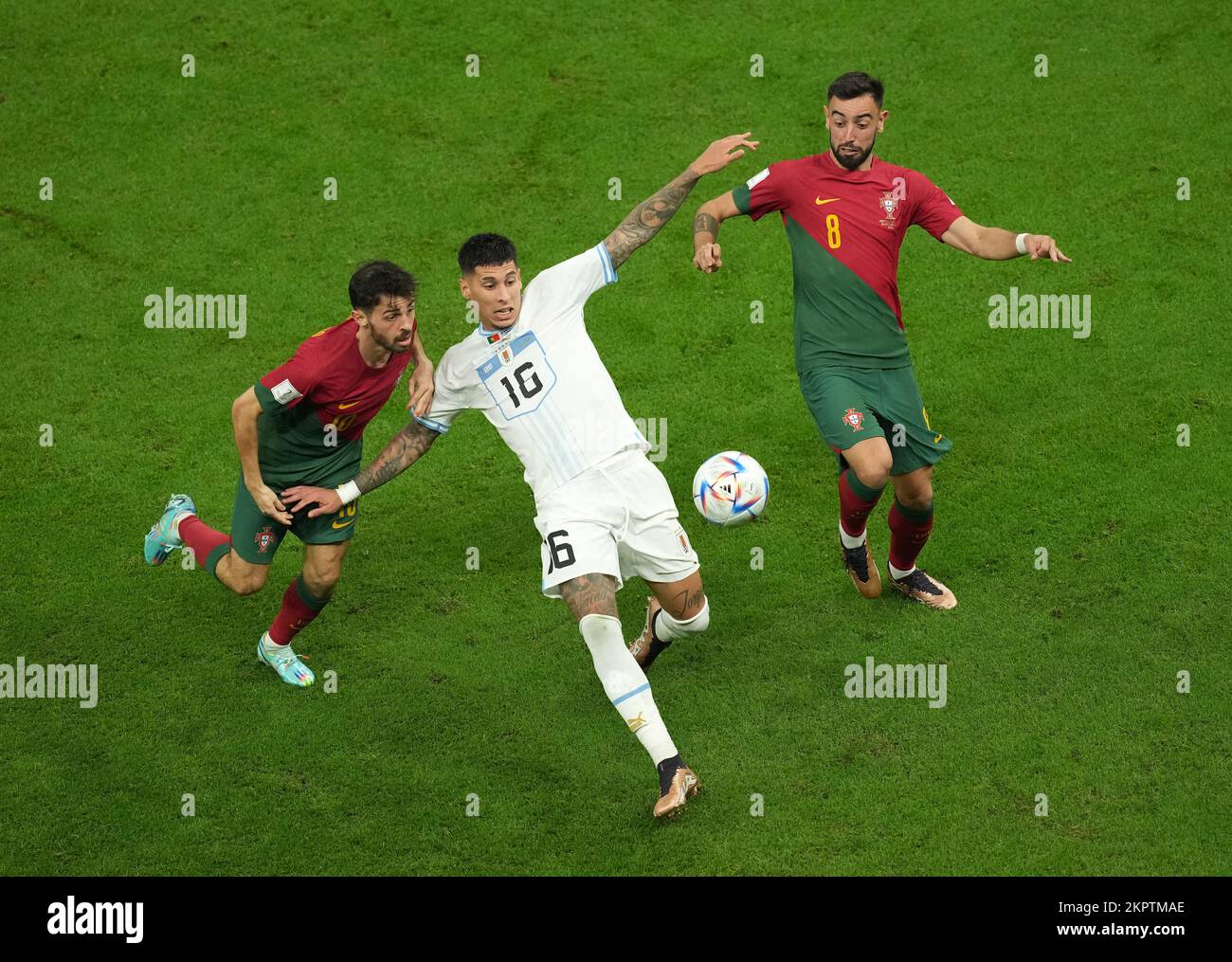 Portugal's Bernardo Silva, Uruguay's Mathias Olivera and Portugal's ...