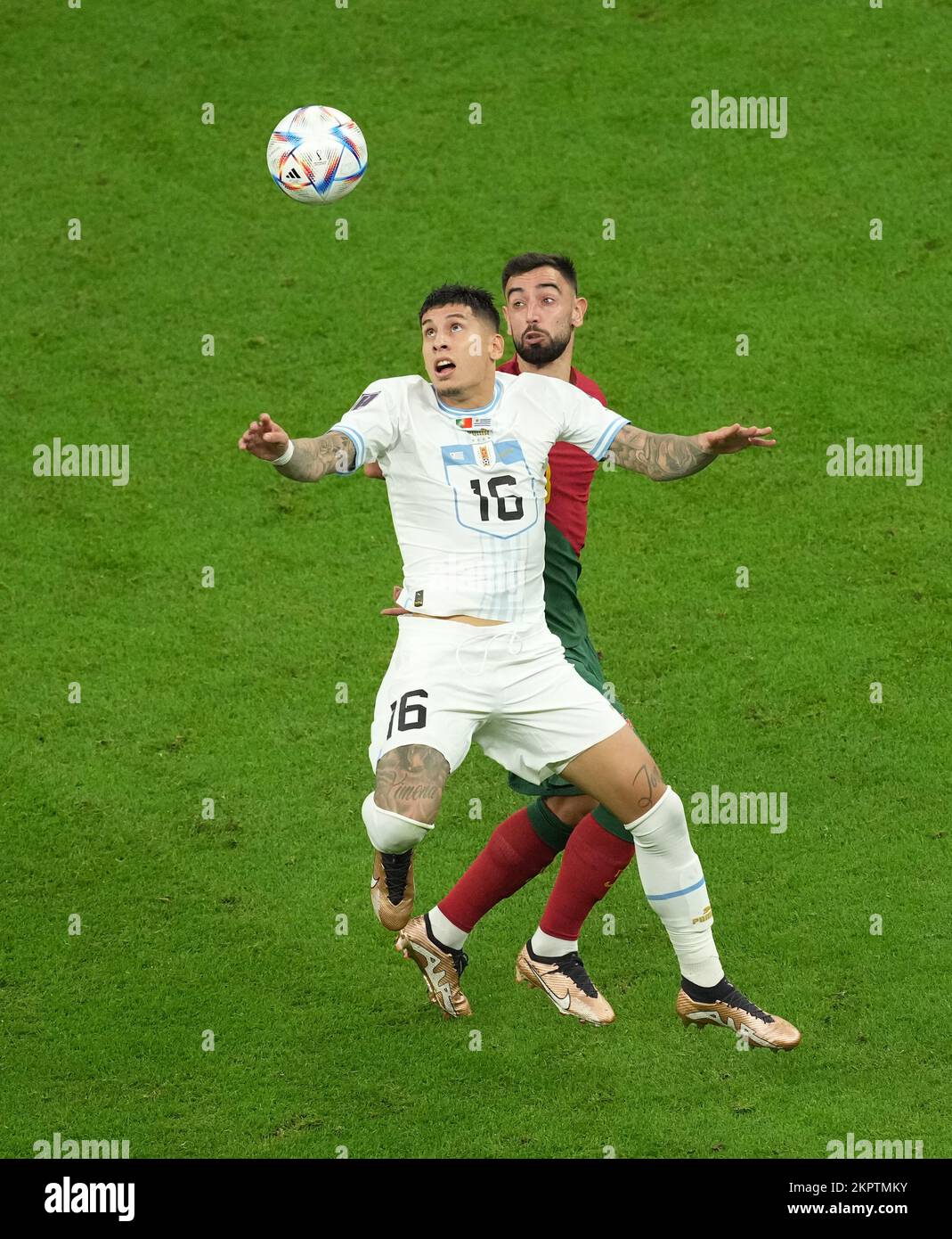 Uruguay's Mathias Olivera (left) and Portugal's Bruno Fernandes battle ...