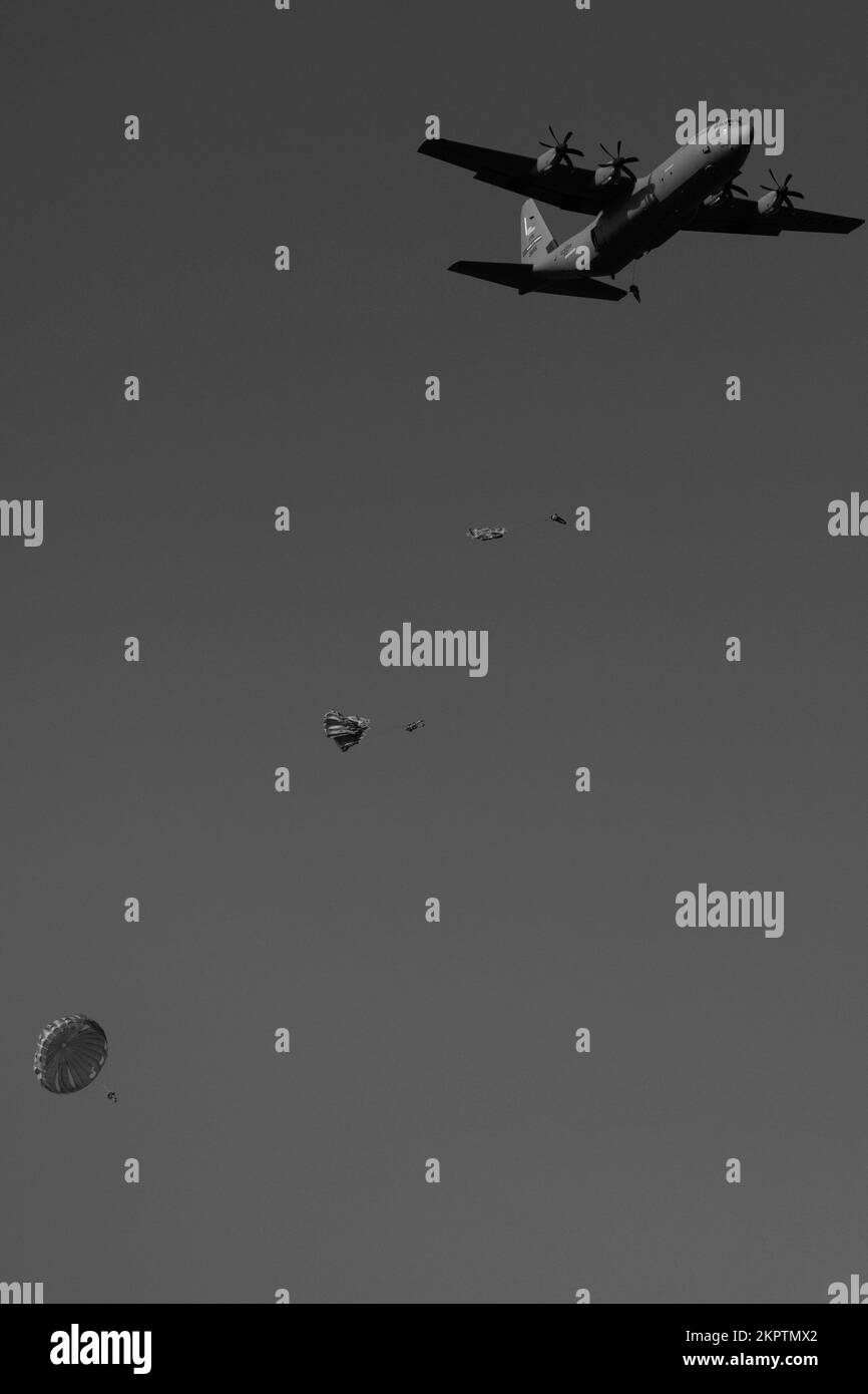 Members assigned to joint special operations forces jump out of a C ...