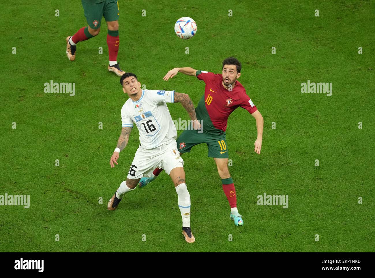 Uruguay's Mathias Olivera (left) and Portugal's Bruno Fernandes battle ...