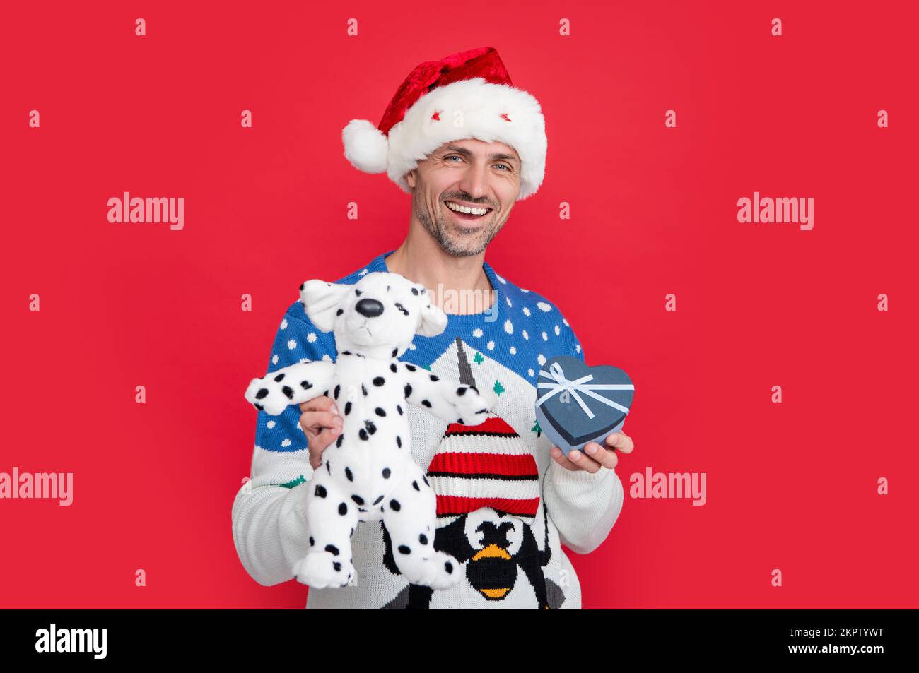 merry christmas and happy new year. happy man hold christmas gift ...