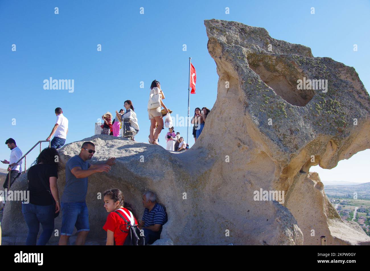 Uchisar - Turkey - Some tourists on the famous castle of Uchisar Stock ...